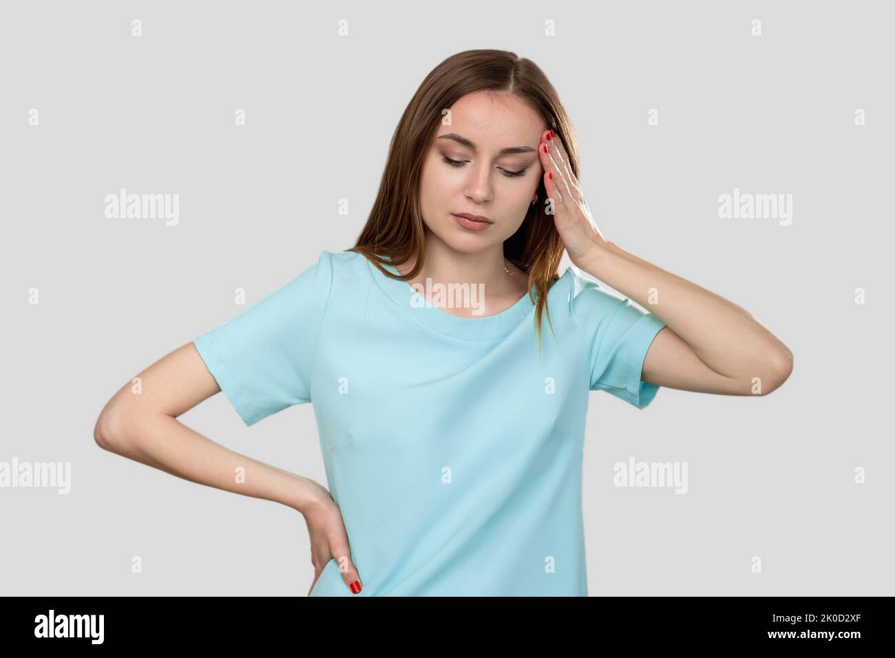 tired woman migraine pain troubled touching head Stock Photo - Alamy