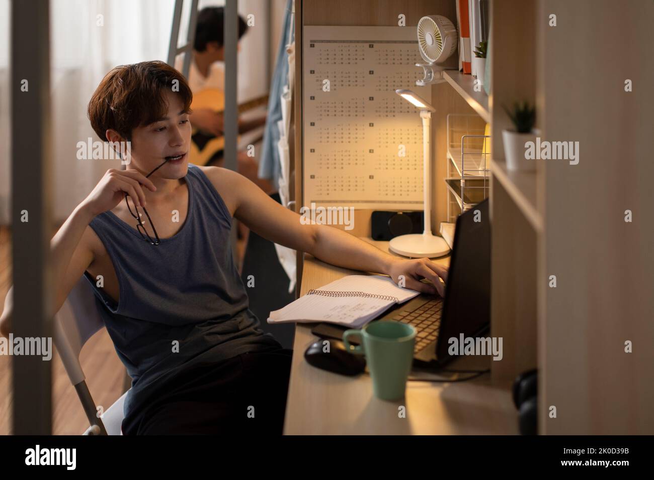 Young Chinese university student learning in dormitory Stock Photo - Alamy