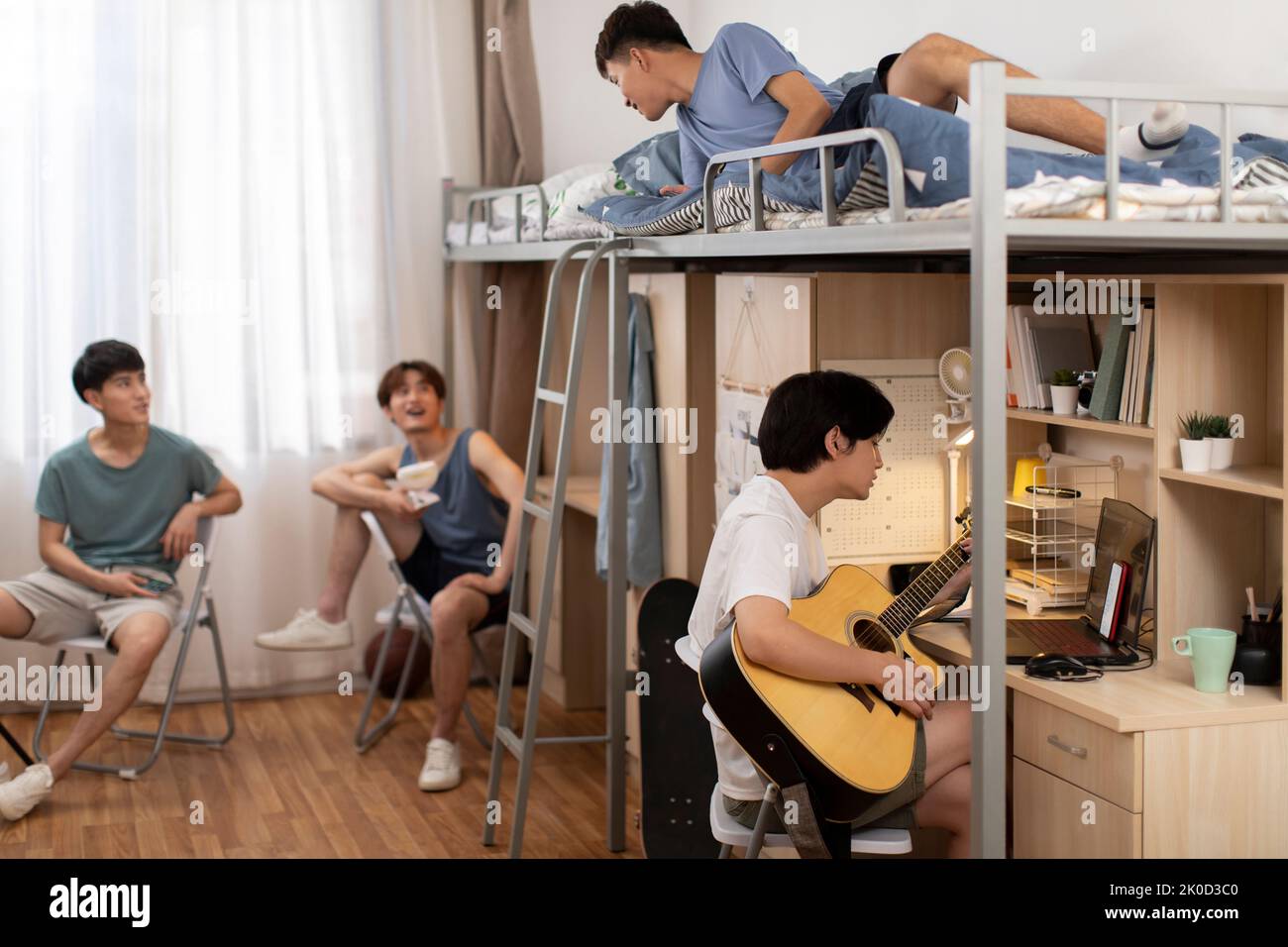 Young Chinese university students relaxing in dormitory Stock Photo - Alamy