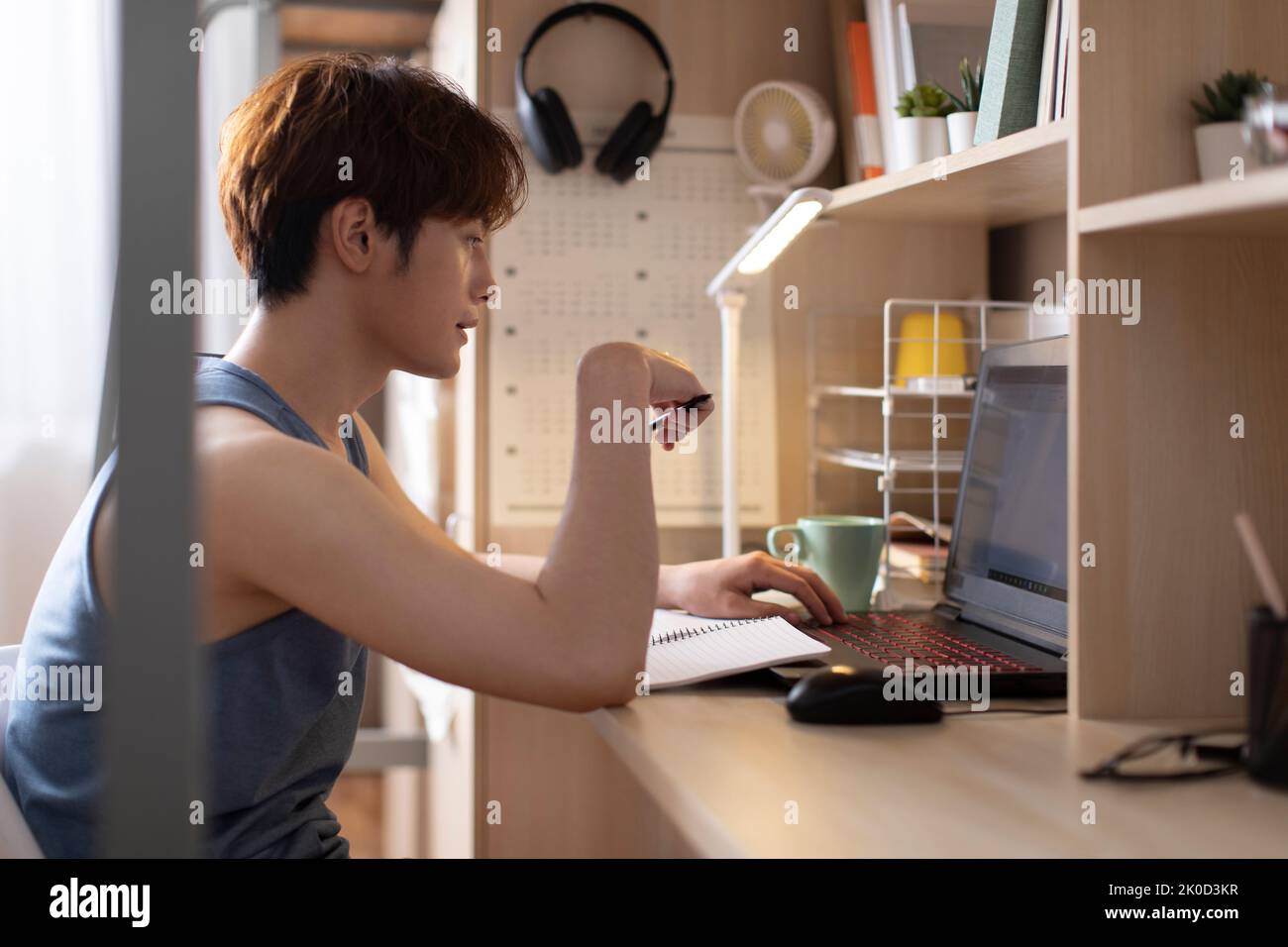 Young Chinese university student learning in dormitory Stock Photo - Alamy