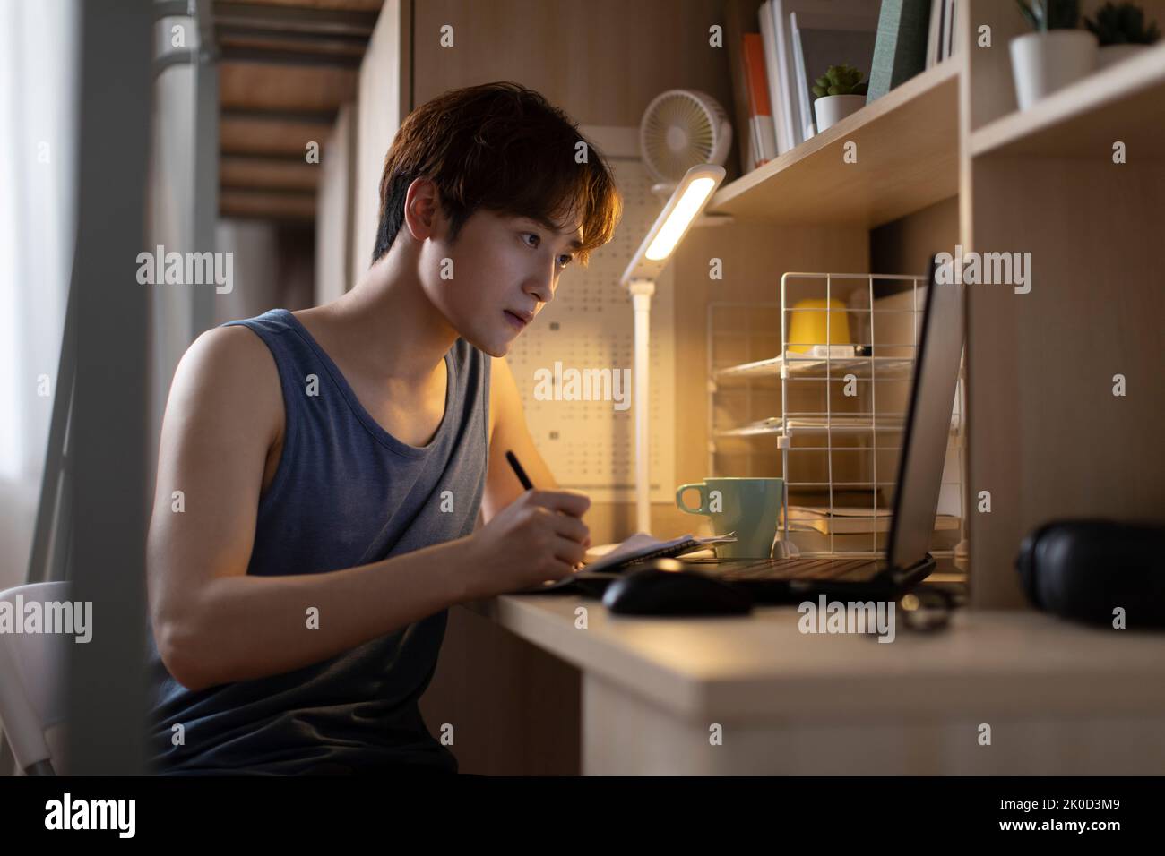 Young Chinese university student learning in dormitory Stock Photo - Alamy