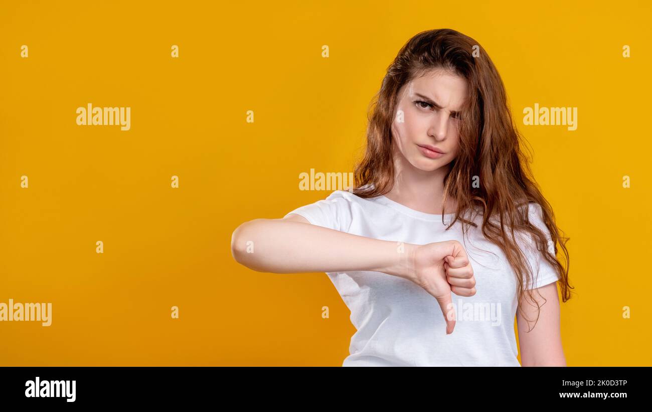 dislike sign wrong choice skeptic woman thumb down Stock Photo - Alamy