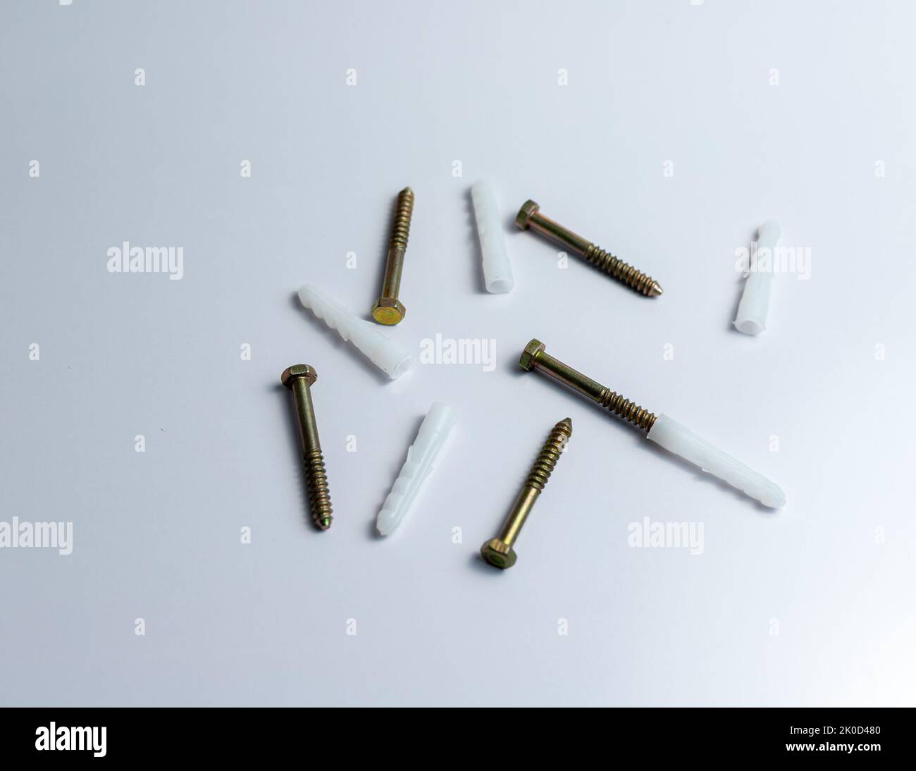 Screw bolt with plastic plugs on isolated white background Stock Photo ...