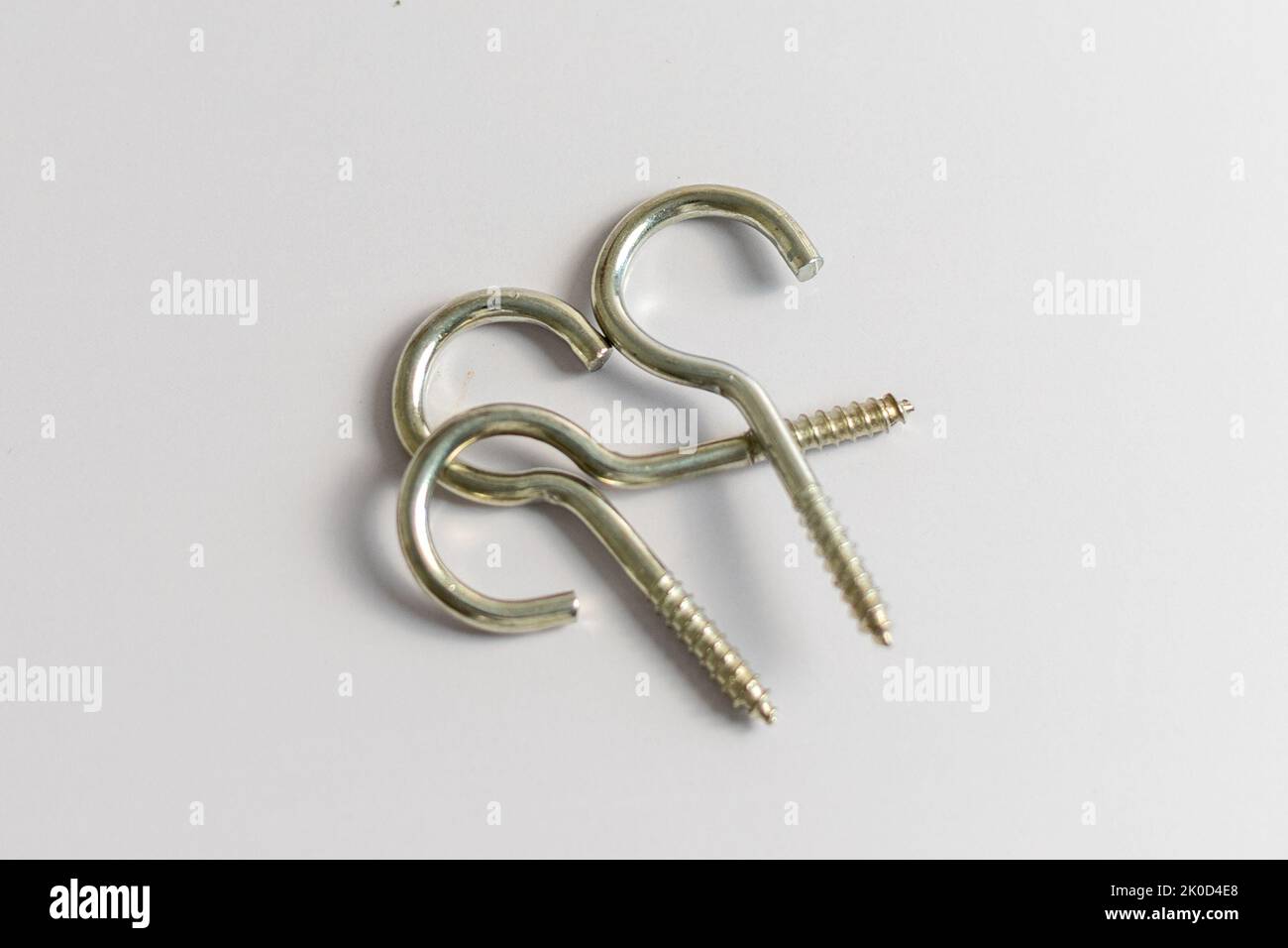 Heap of question mark hook on isolated white background Stock Photo - Alamy