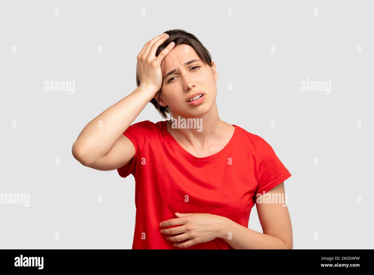 feeling headache exhausted woman portrait Stock Photo - Alamy