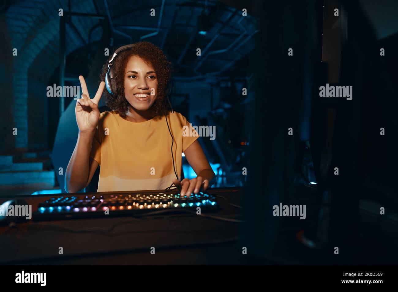 A young cyber gamer girl plays rpg games and shooters Stock Photo - Alamy