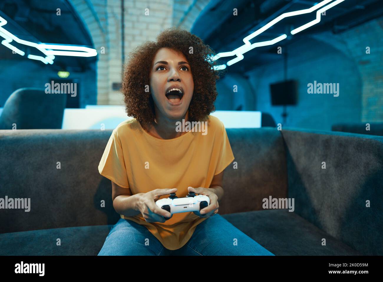 A young cyber gamer girl plays rpg games and shooters Stock Photo - Alamy