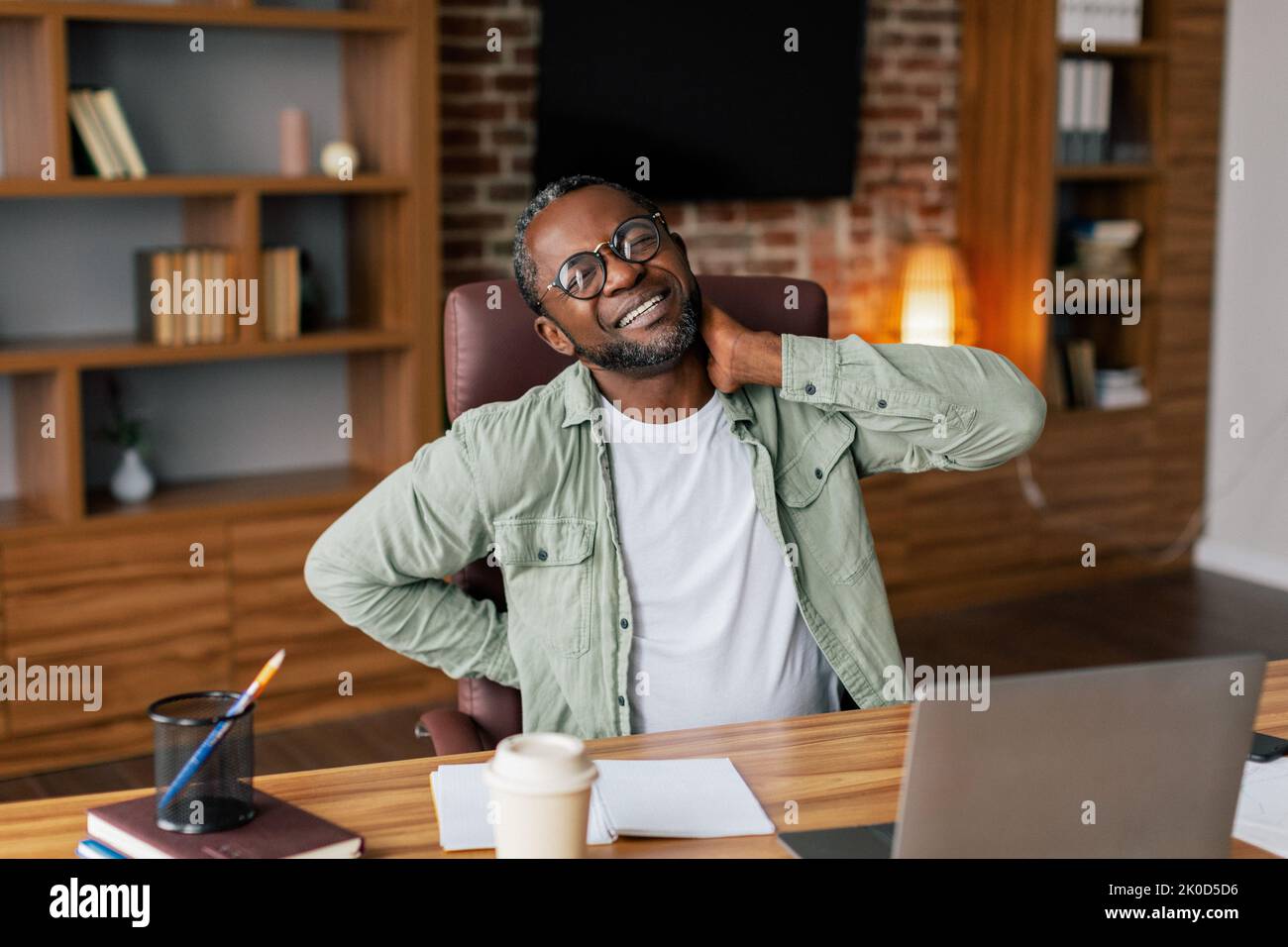 Sad mature african american male manager in glasses, casual suffers ...