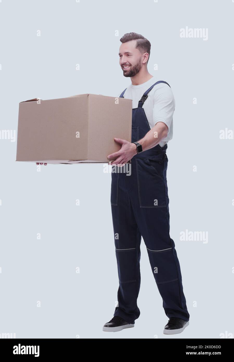 rear view. a young man with a cardboard box looking at the camera Stock ...