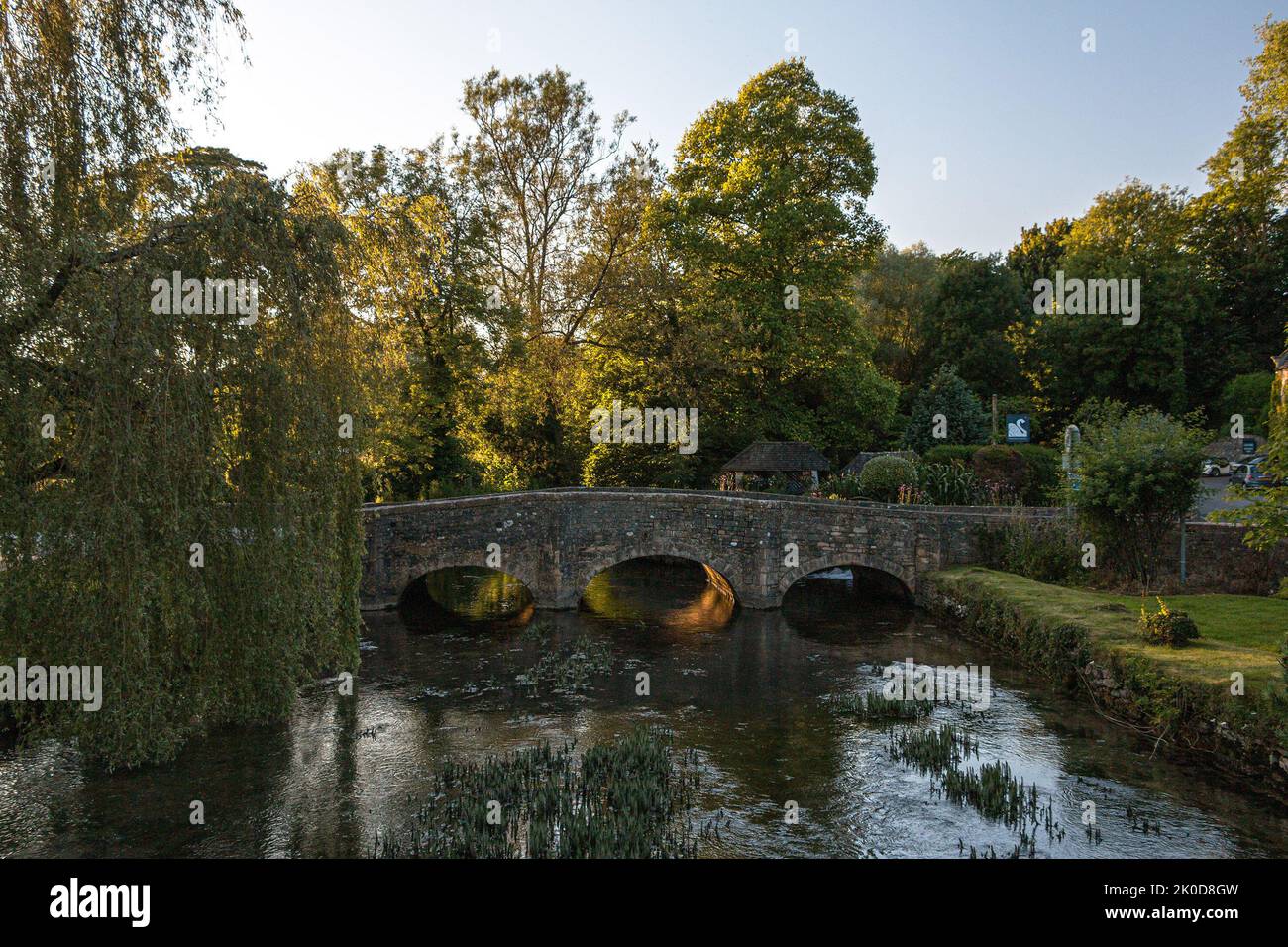 A stone bridge over the River Coln in Bibury, United Kingdom Stock ...