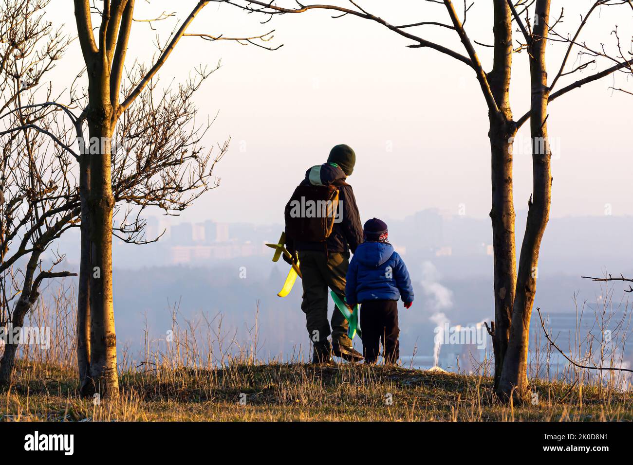 Two children are looking at the city from above Stock Photo - Alamy