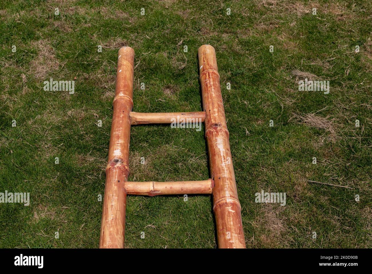 Brown ladder with a new challenge or promotion concept Stock Photo - Alamy