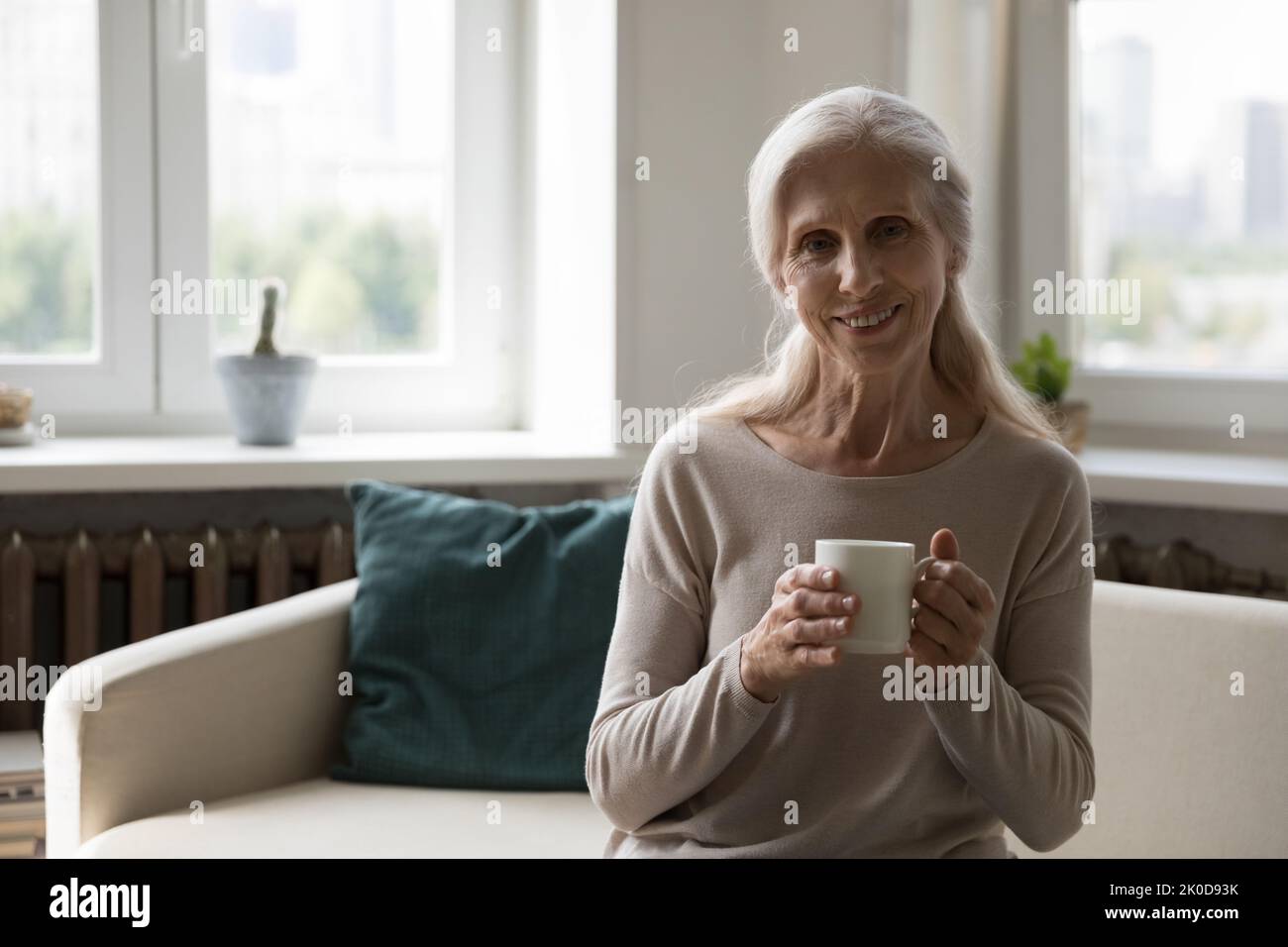 Happy elderly lady drinking tea at home, enjoying good morning Stock ...