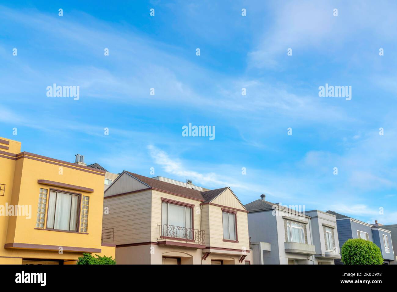 Suburbs houses with colorful exterior against the sky in San Francisco ...