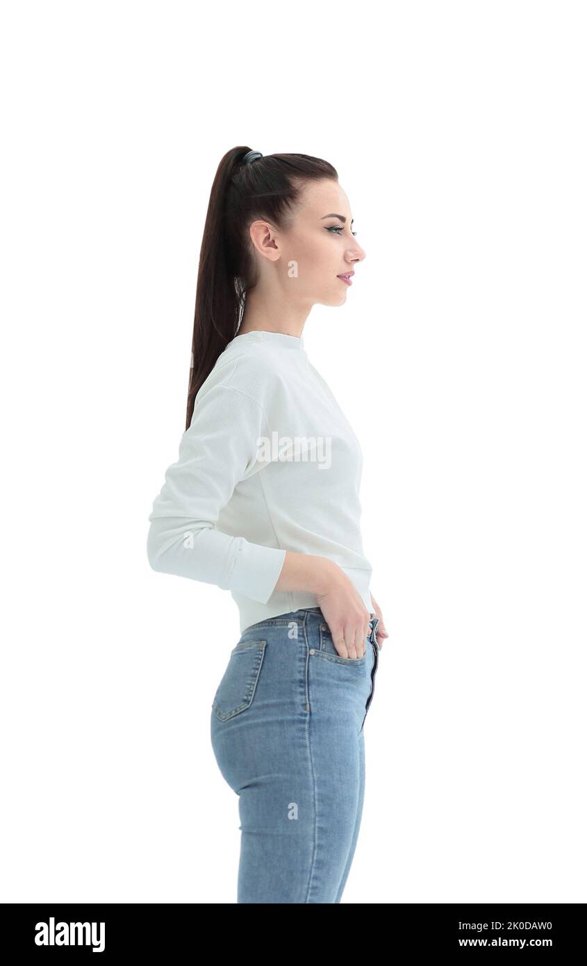 side view. stylish young woman in jeans and white blouse Stock Photo ...