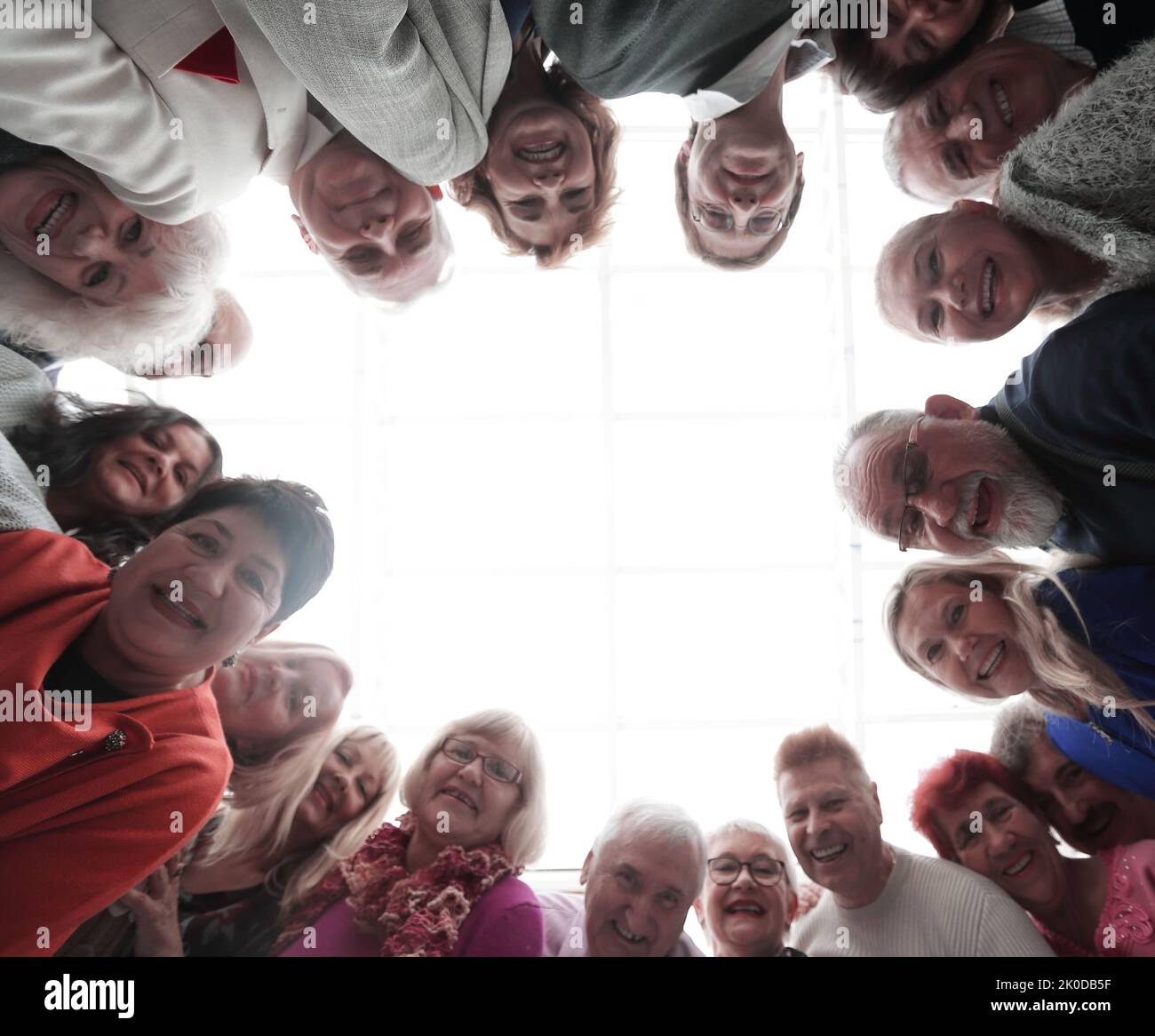 Happy people looking down at camera Stock Photo - Alamy