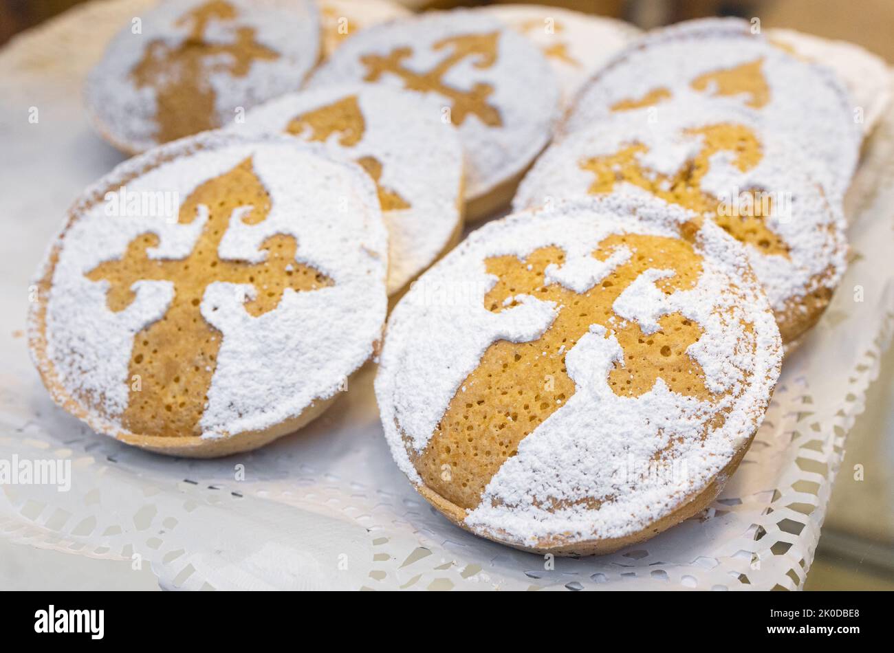 Group of small Tarta de Santiago on bakery store window of Santiago de ...