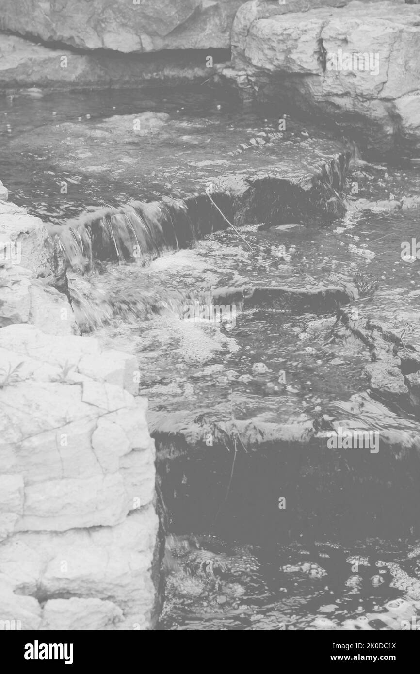 Water rushing over river rocks Black and White Stock Photos & Images ...