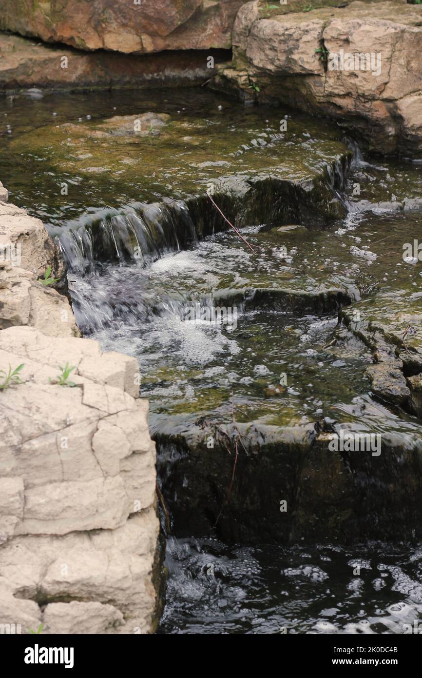 A bubbling creek running over the rocks and stones Stock Photo - Alamy