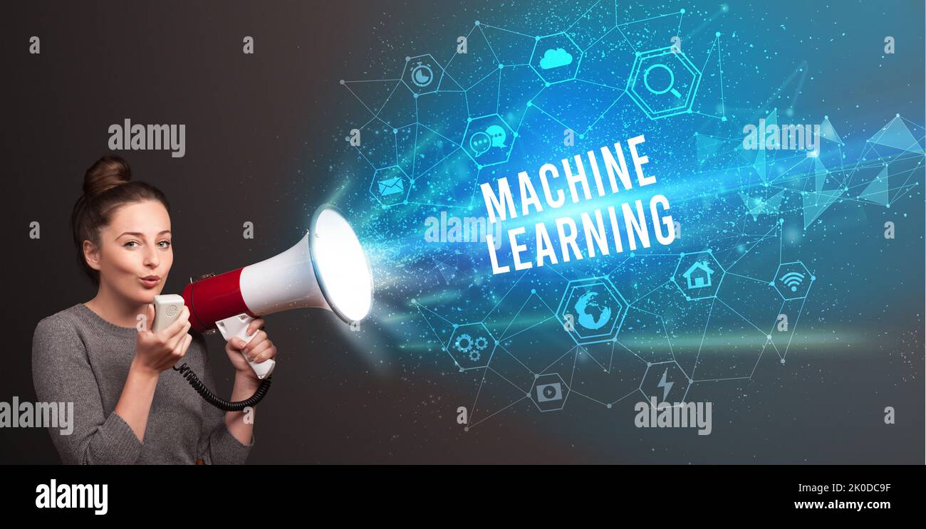 Young woman shouting in megaphone, technology announcement concept ...