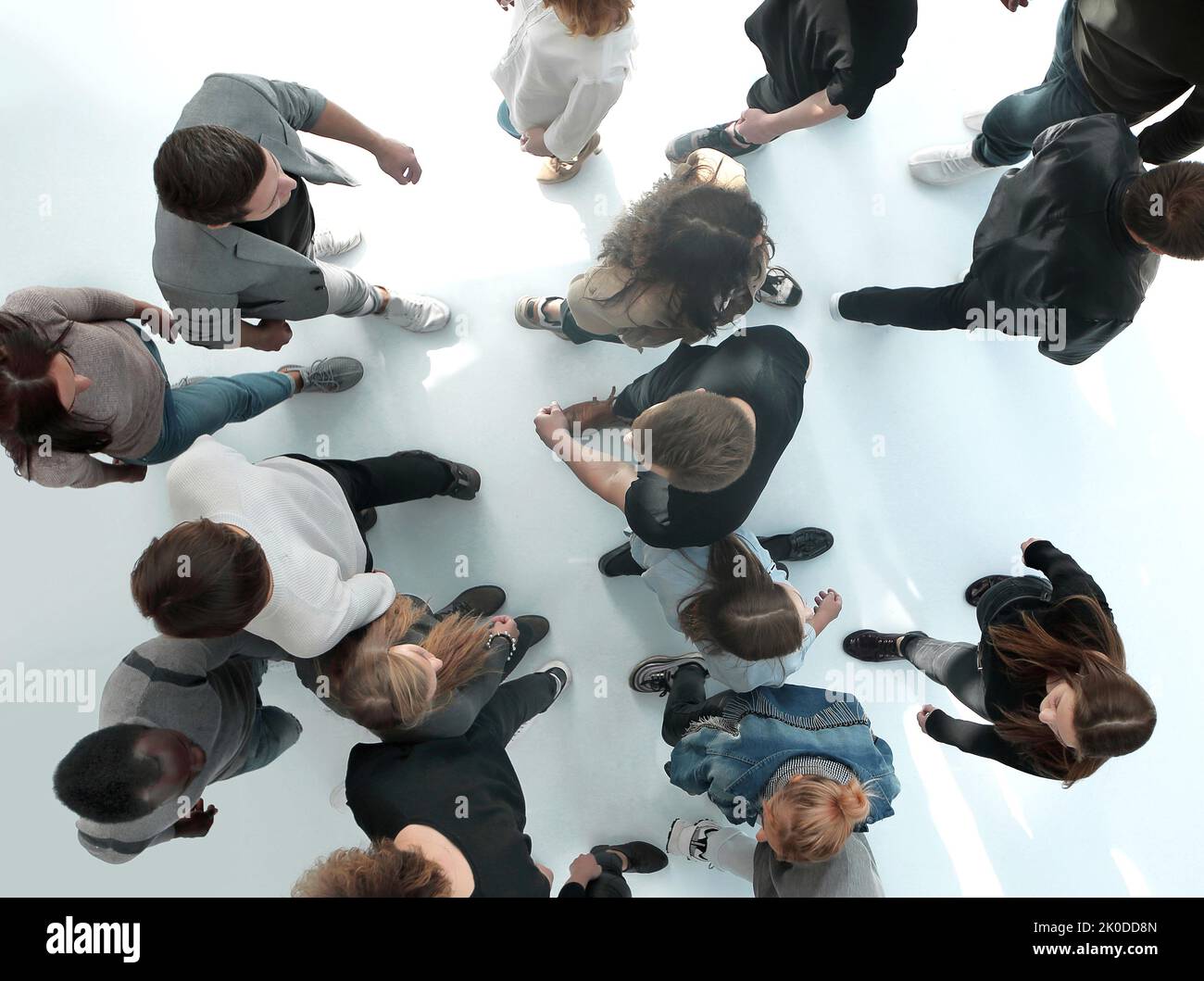 top view .groups of diverse young people moving towards each other ...