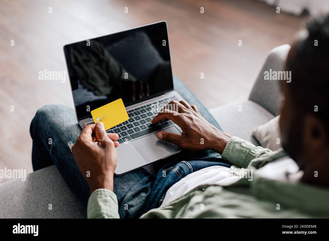 Middle aged african american guy typing on computer with blank screen ...