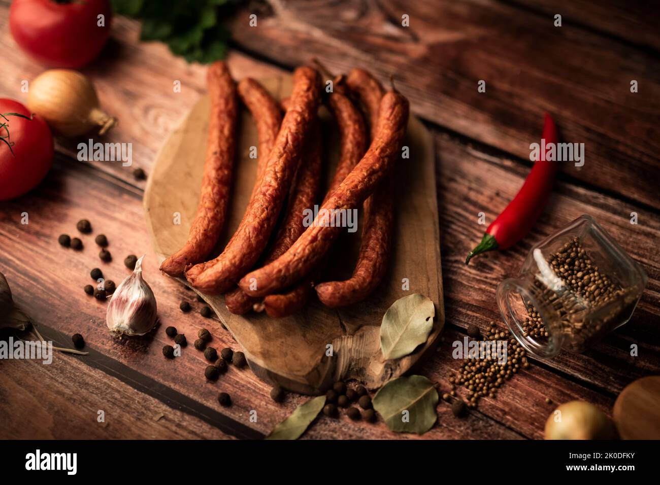 Top view of sausage, on a wood background. Traditional meat sausage, a ...
