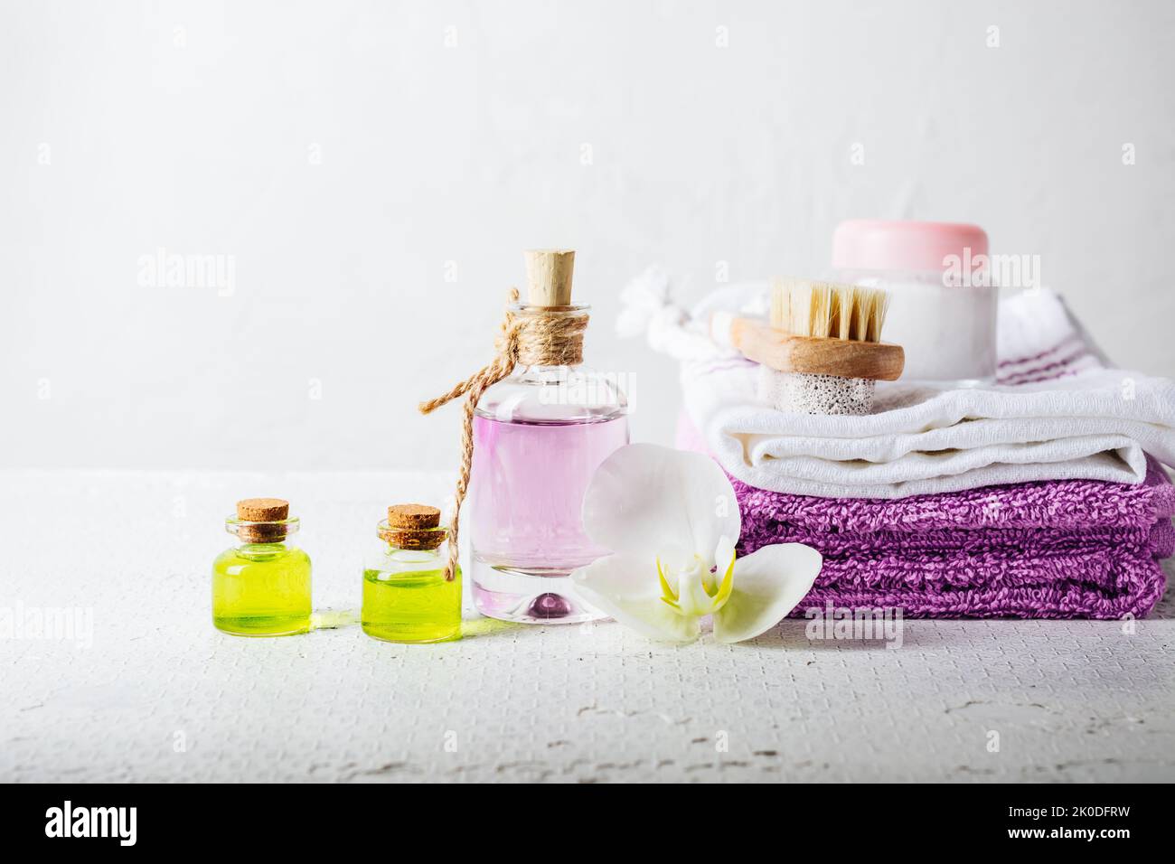 Essential oils, perfumed water in glass bottles on white background ...