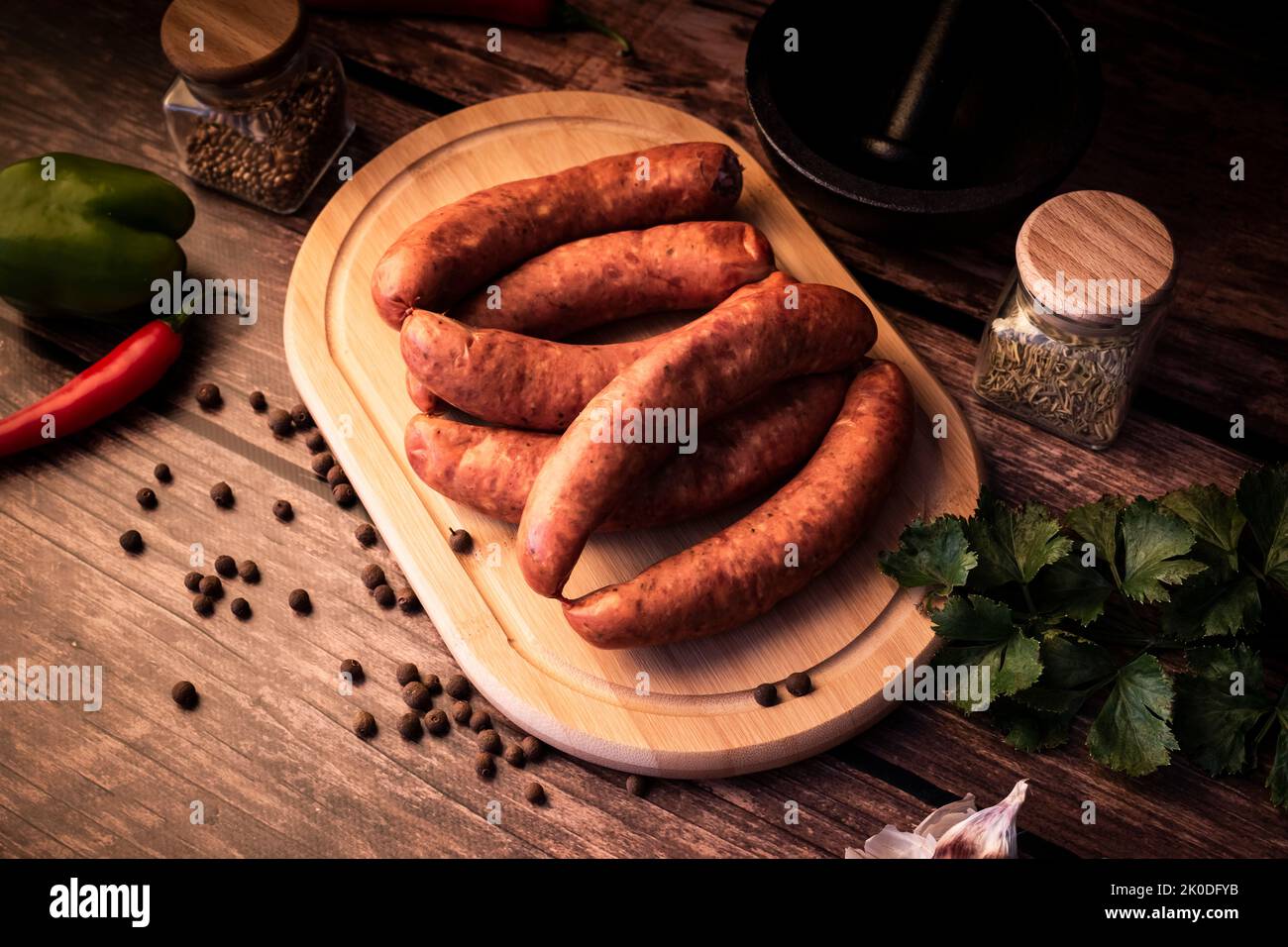 Top view of sausage, on a wood background. Traditional meat sausage, a ...