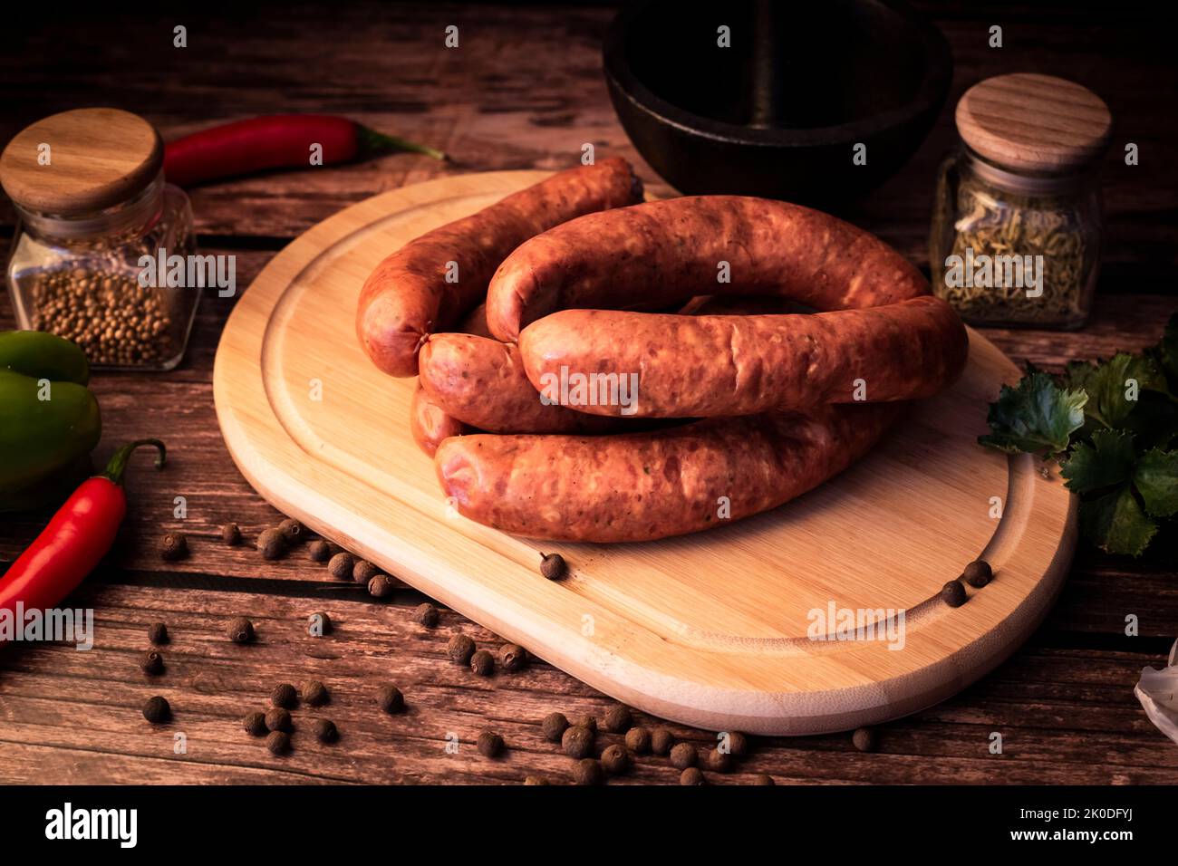 Top view of sausage, on a wood background. Traditional meat sausage, a ...
