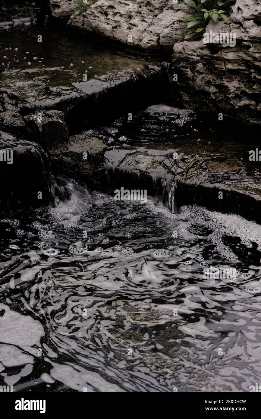 Water bubbling over wet rocks hi-res stock photography and images - Alamy