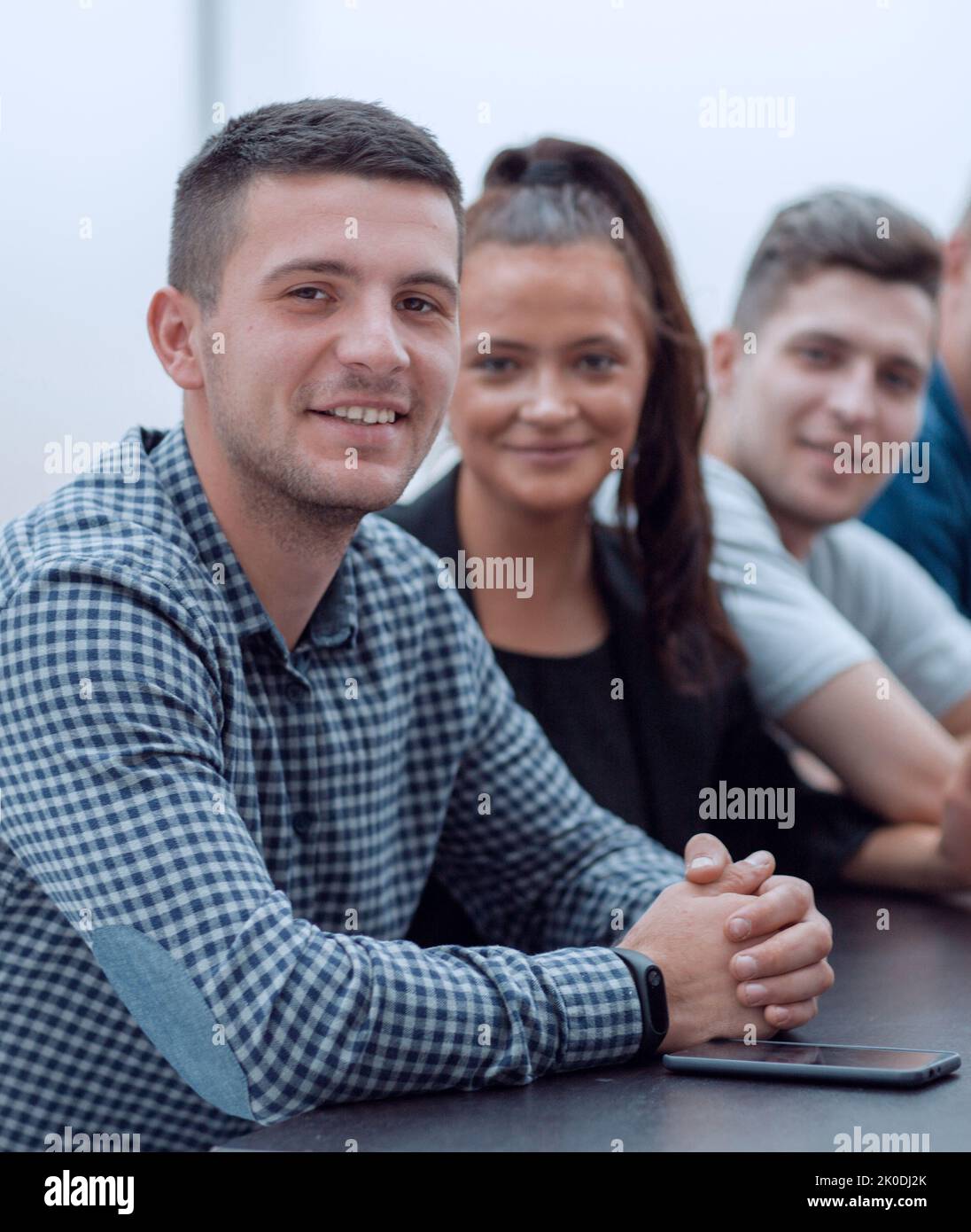 group of creative young people sitting at an office Desk Stock Photo ...