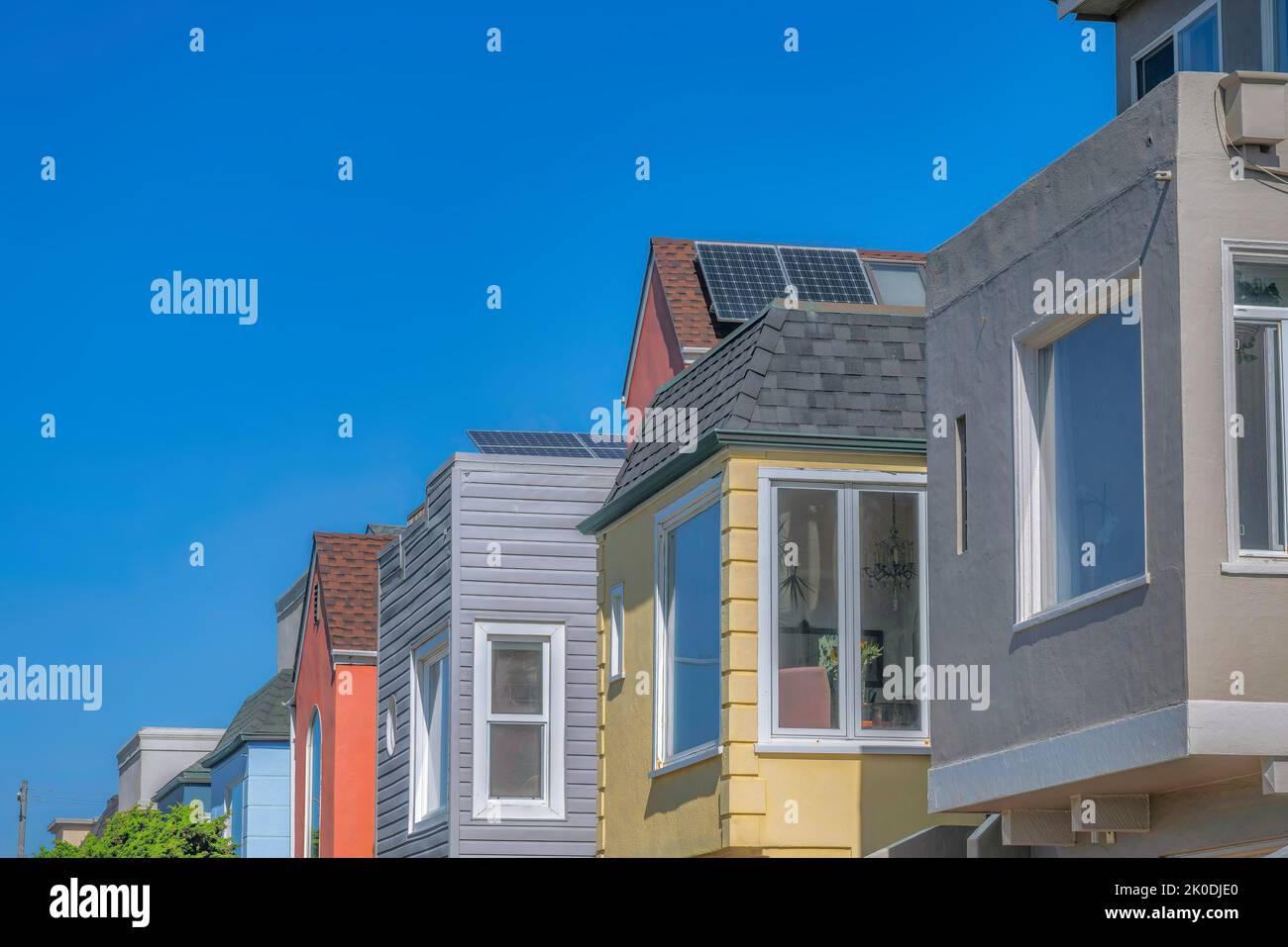 Side view of suburban houses with clear glass window panes in San ... Side view of suburban houses with clear glass window panes in San ...