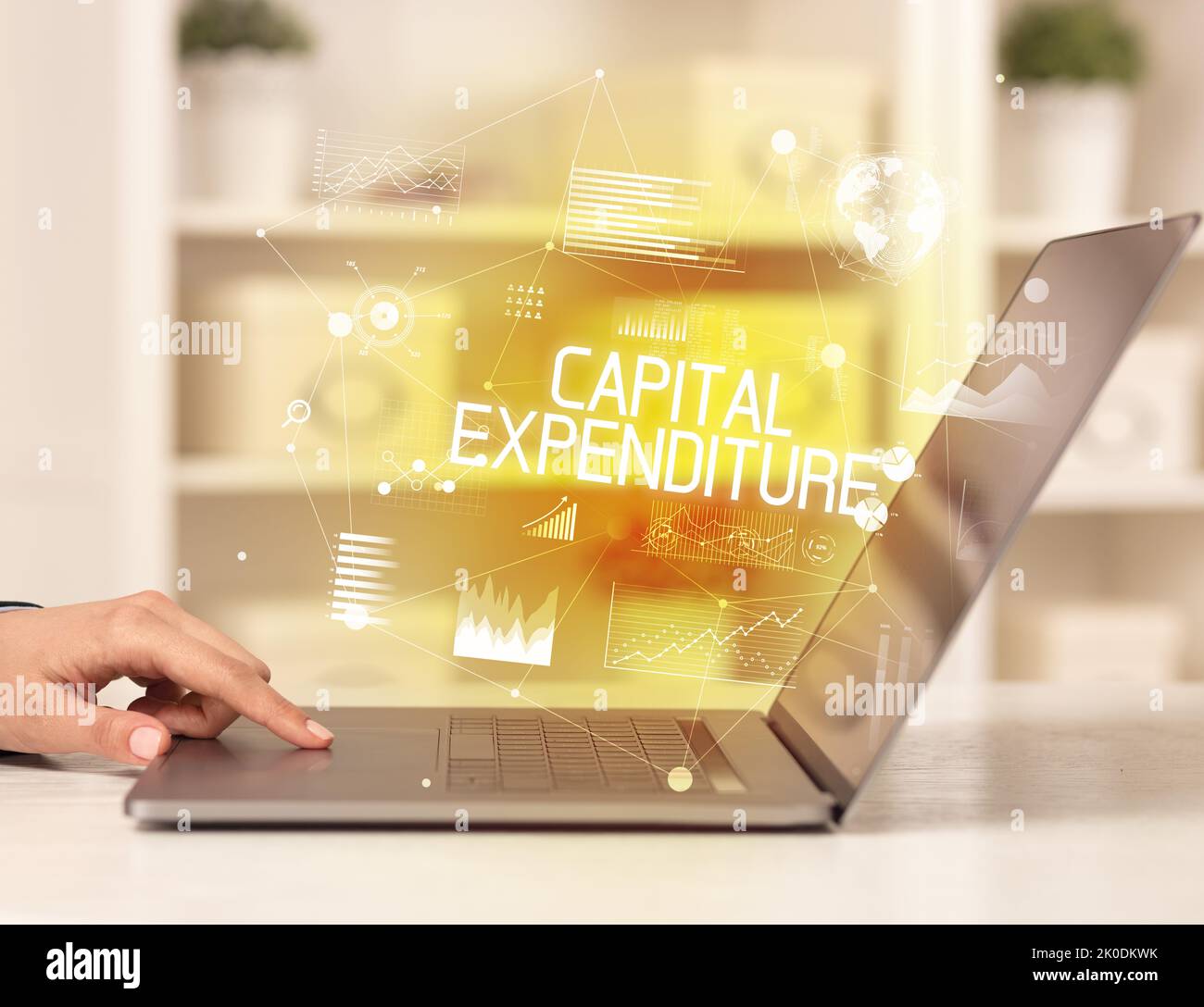 Side view of a business person working on laptop Stock Photo - Alamy