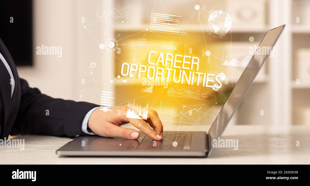 Side view of a business person working on laptop Stock Photo - Alamy