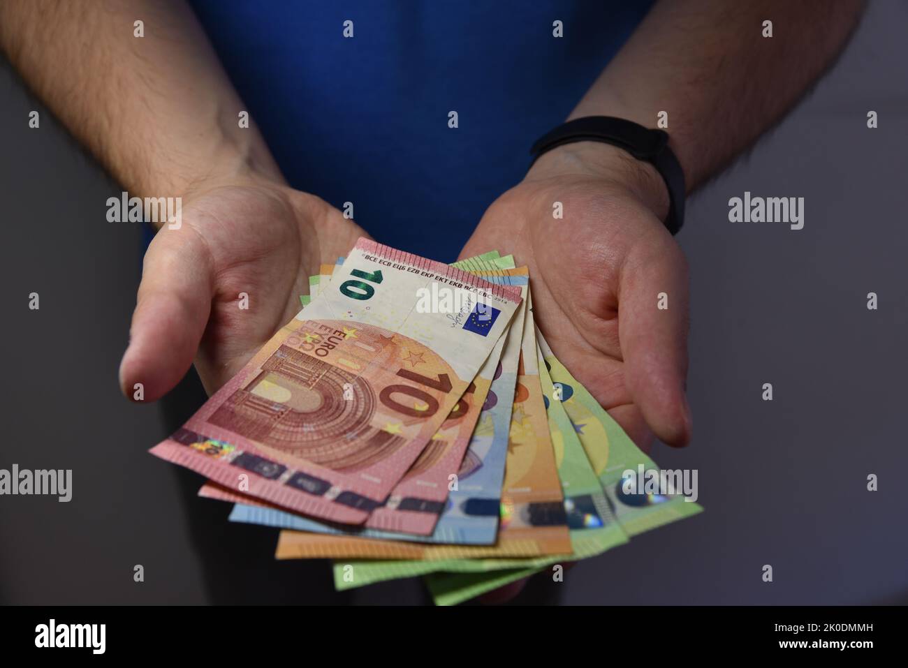 a man with euro bank notes in his hands Stock Photo - Alamy