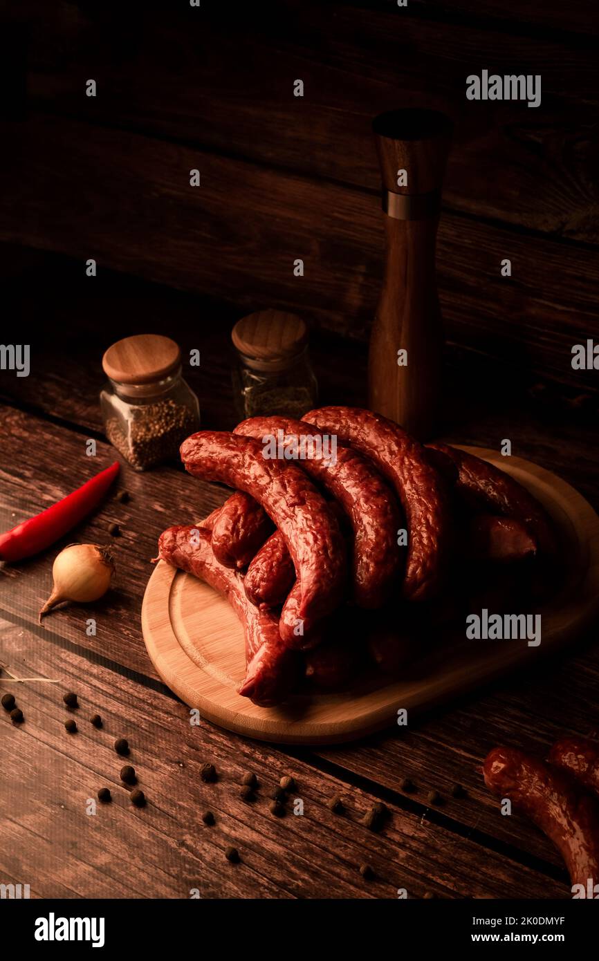 Top view of sausage, on a wood background. Traditional meat sausage, a ...
