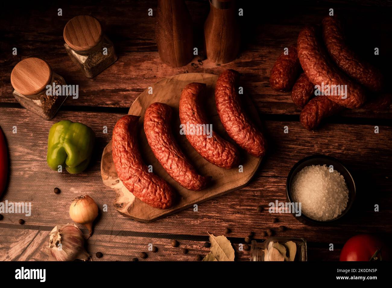 Top view of sausage, on a wood background. Traditional meat sausage, a ...
