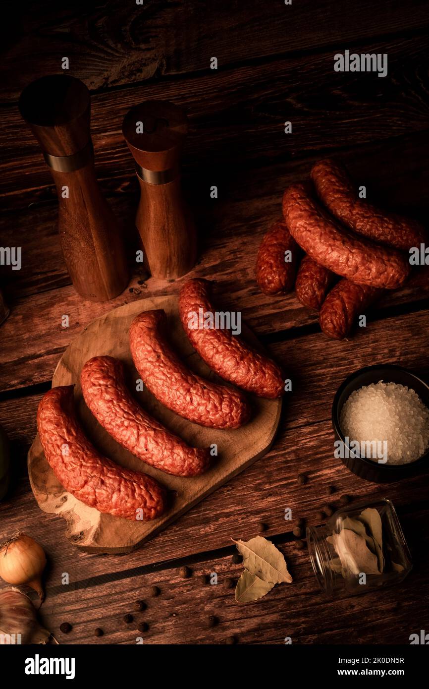 Top view of sausage, on a wood background. Traditional meat sausage, a ...
