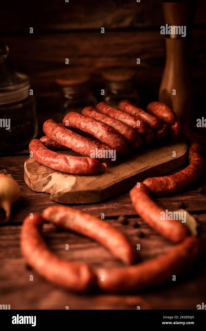 Top view of sausage, on a wood background. Traditional meat sausage, a ...