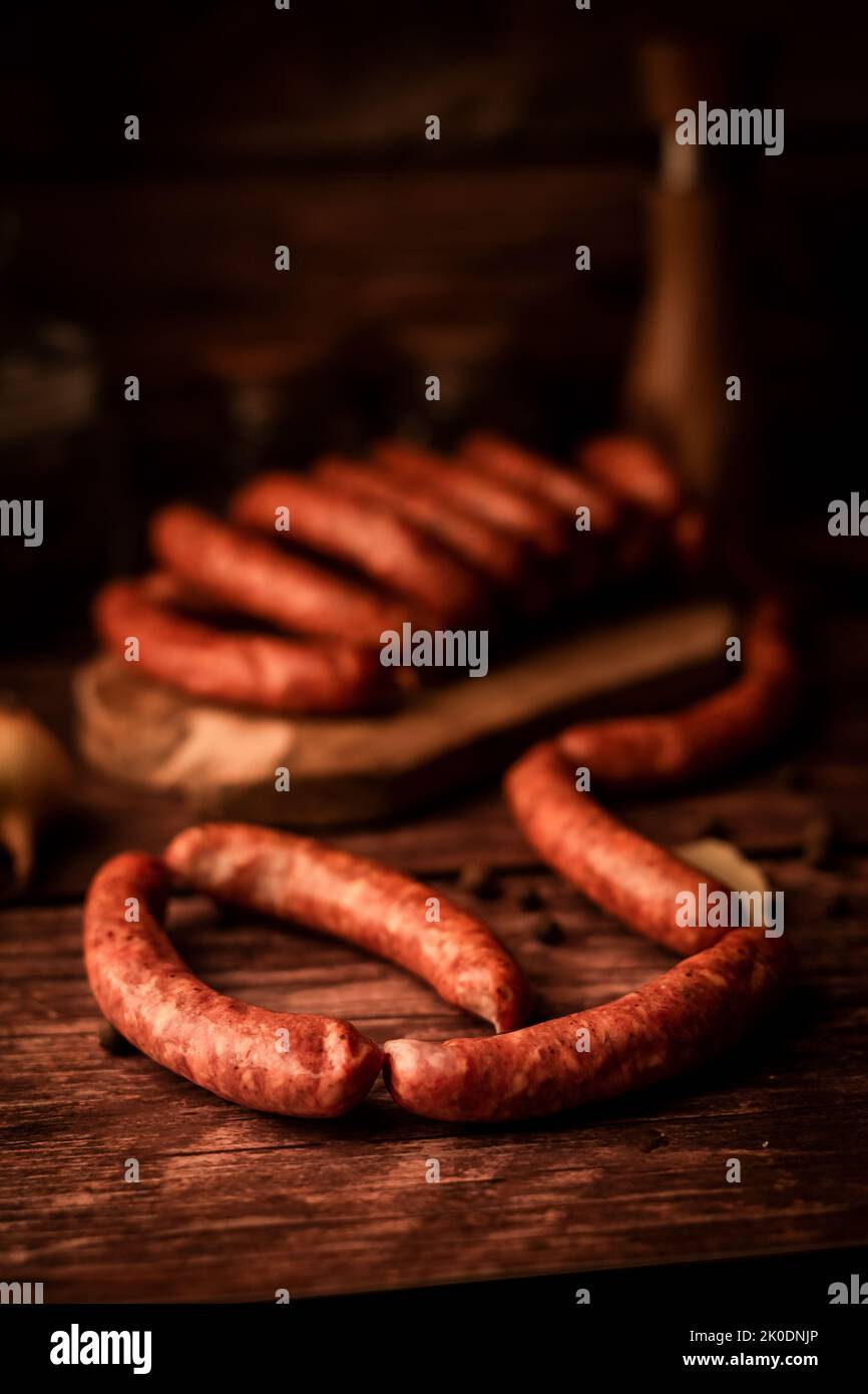 Top view of sausage, on a wood background. Traditional meat sausage, a ...