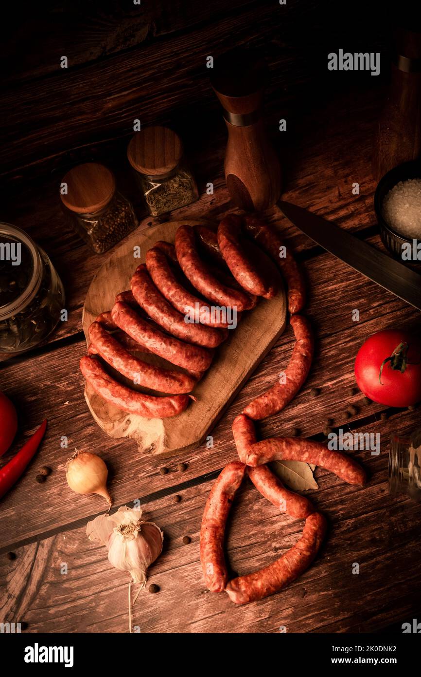 Top view of sausage, on a wood background. Traditional meat sausage, a ...