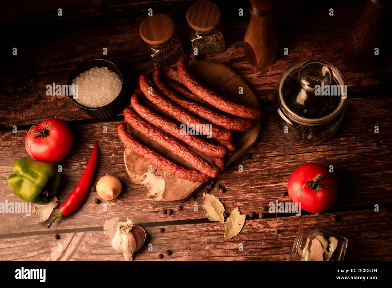 Top view of sausage, on a wood background. Traditional meat sausage, a ...