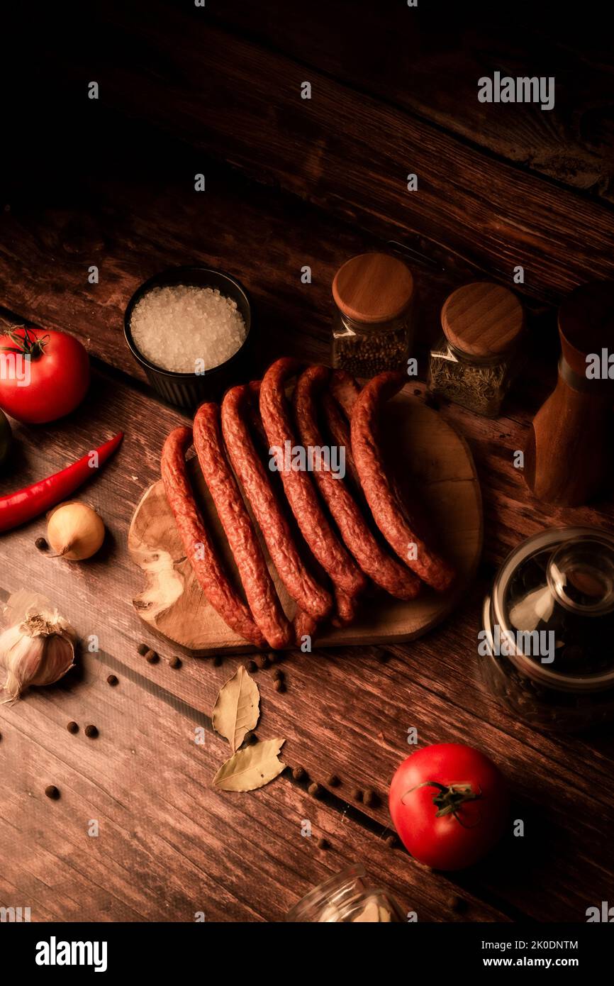 Top view of sausage, on a wood background. Traditional meat sausage, a ...