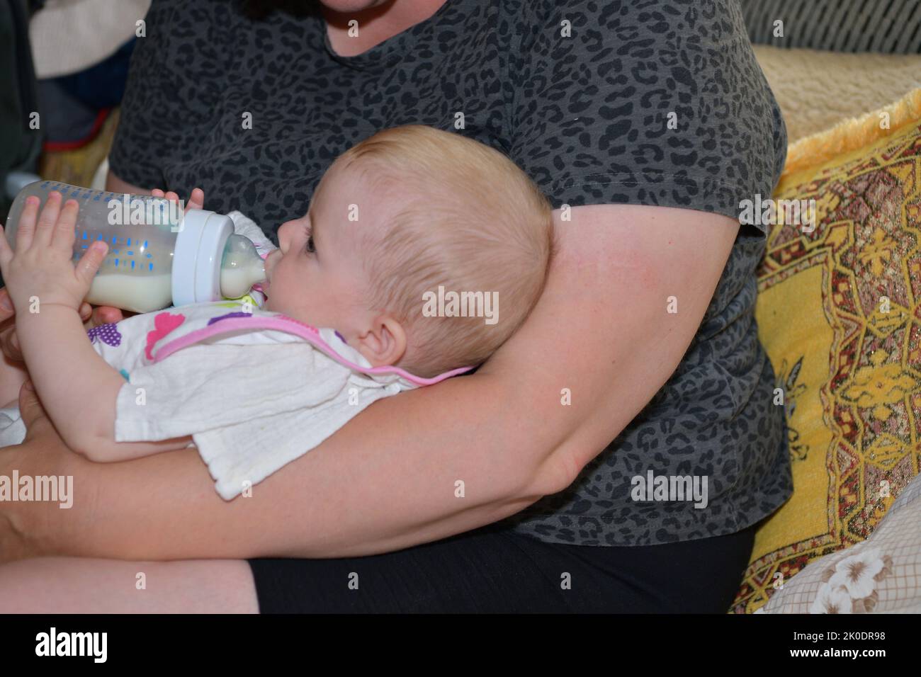 Portrait of a baby's mouth being fed baby gruel Stock Photo - Alamy