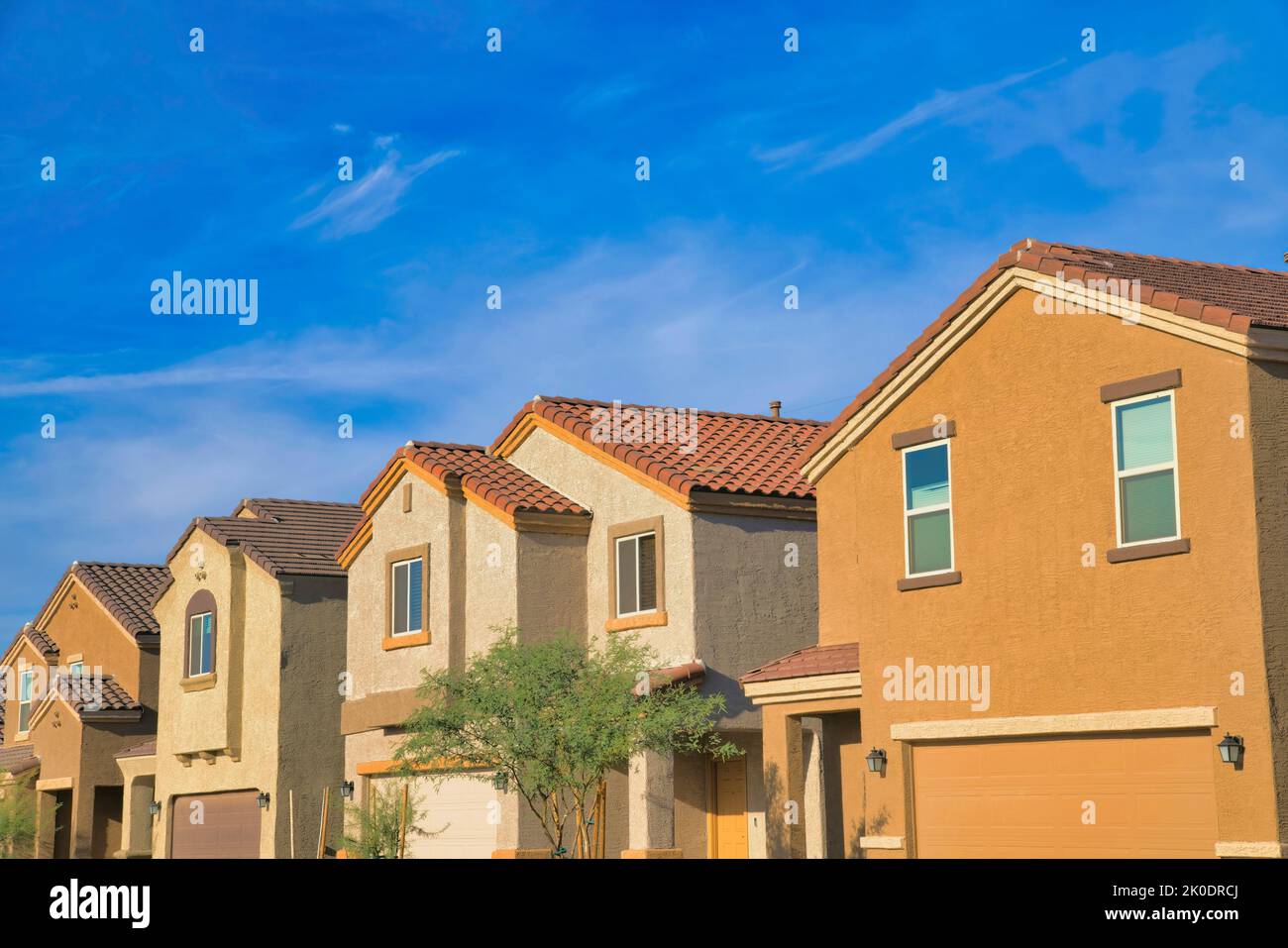 Suburban homes in Tucson, Arizona with attached garage. Row of houses ...