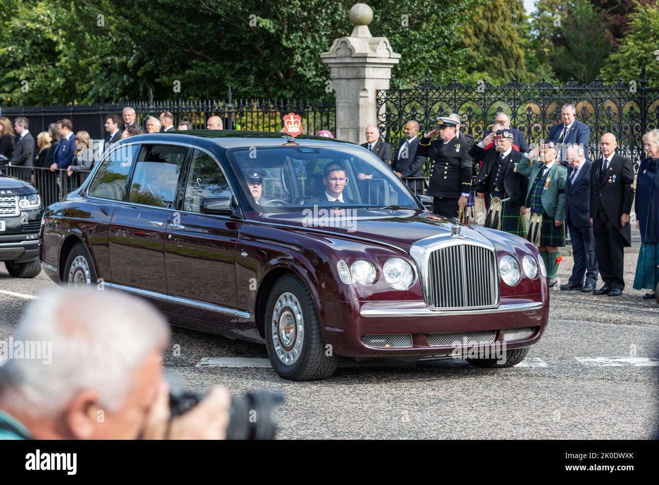 The funeral cortege travels behind the hearse carrying the coffin of ...
