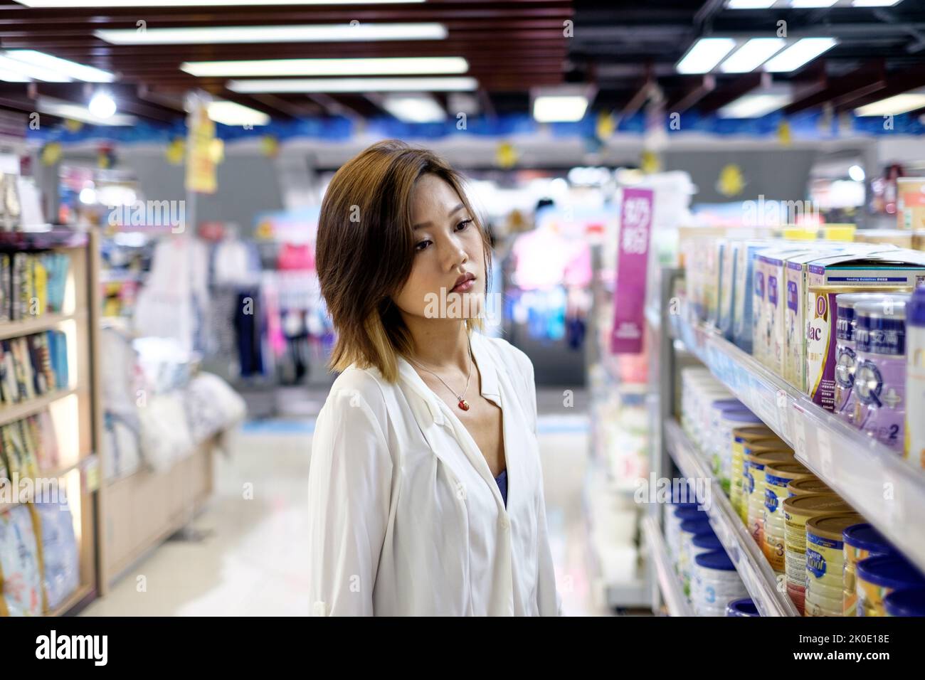 Beautiful Asian lady shopping in a department store Stock Photo - Alamy