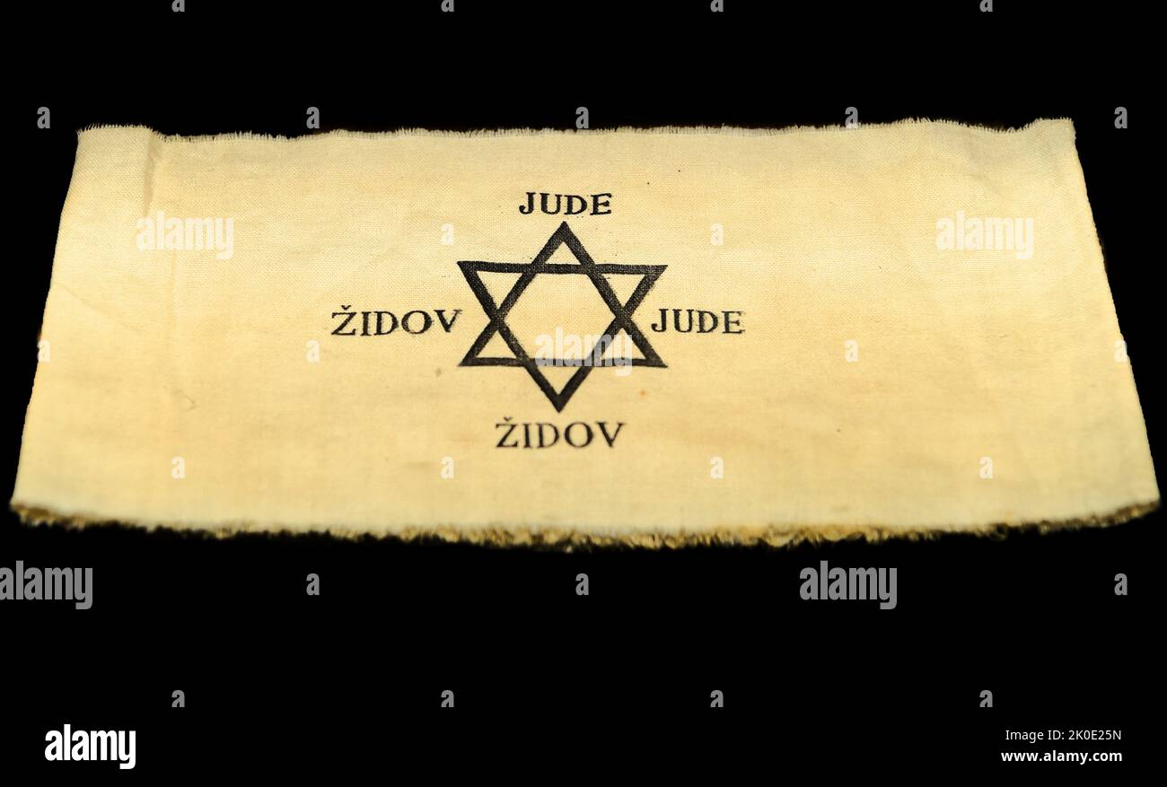 Armband worn by Jewish inmates of the Warsaw Ghetto, the largest of the ...