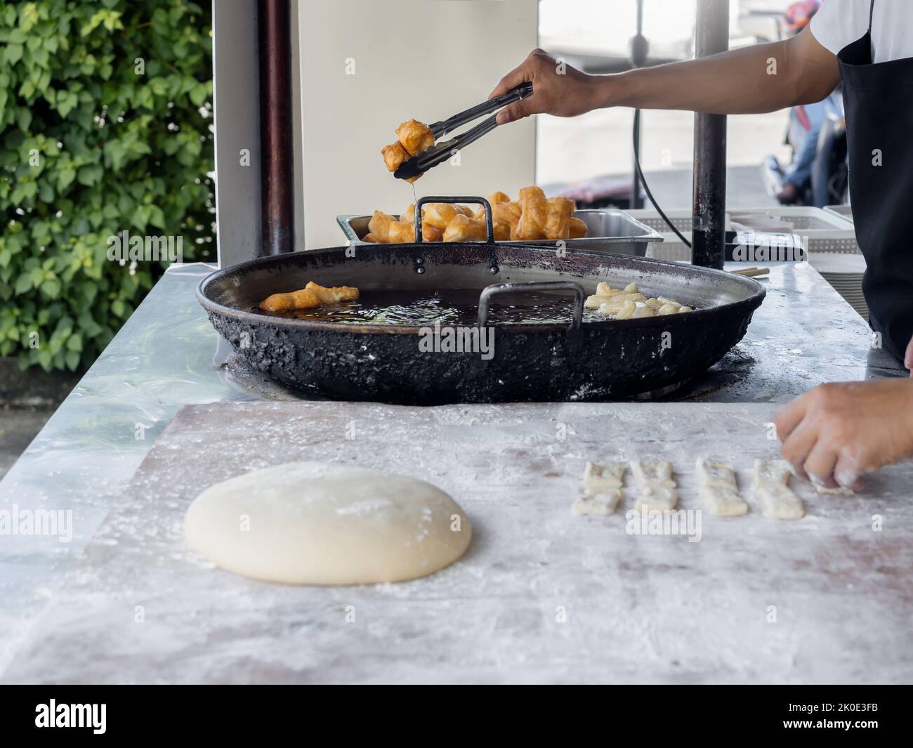 Deep-fried dough sticks or Patongko in Thai, Asian famous street food ...